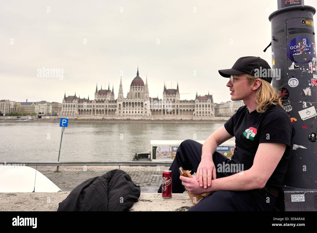 Milan, 26 years-old, relaxes by the Danube river, backdropped by the ...