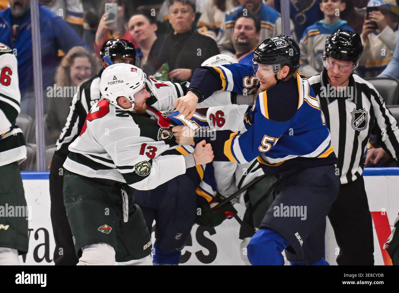 Minnesota Wild's Yakov Trenin (13) fights St. Louis Blues' Colton ...