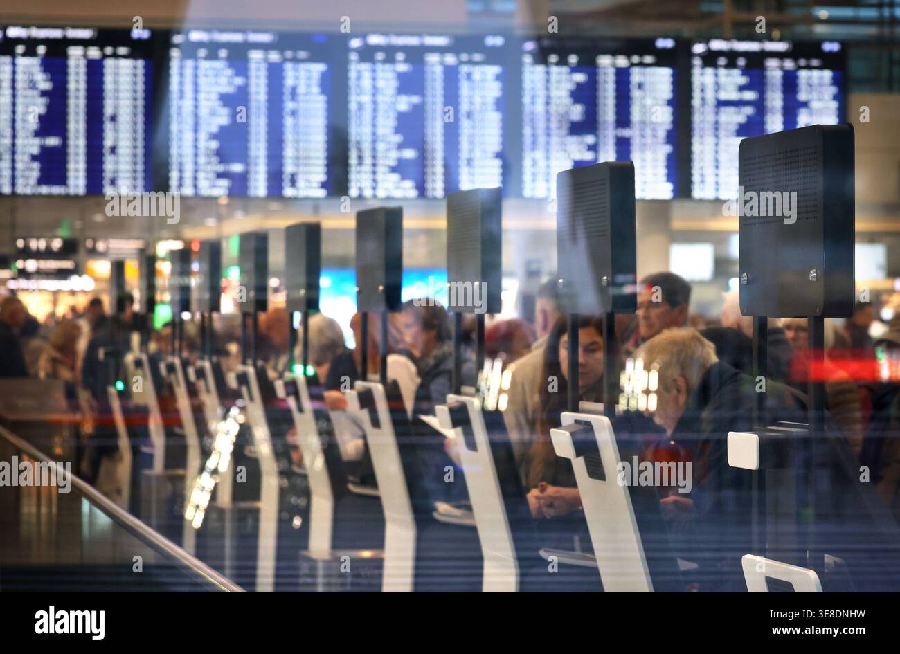 14 April 2026, Bavaria, Munich: People stand in front of a display ...