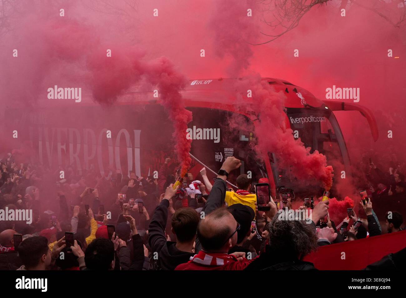 Liverpool fans set of flares as the team bus arrives ahead of the UEFA ...