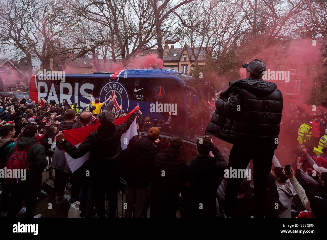 Liverpool fans set of flares as the PSG team bus arrives ahead of the ...