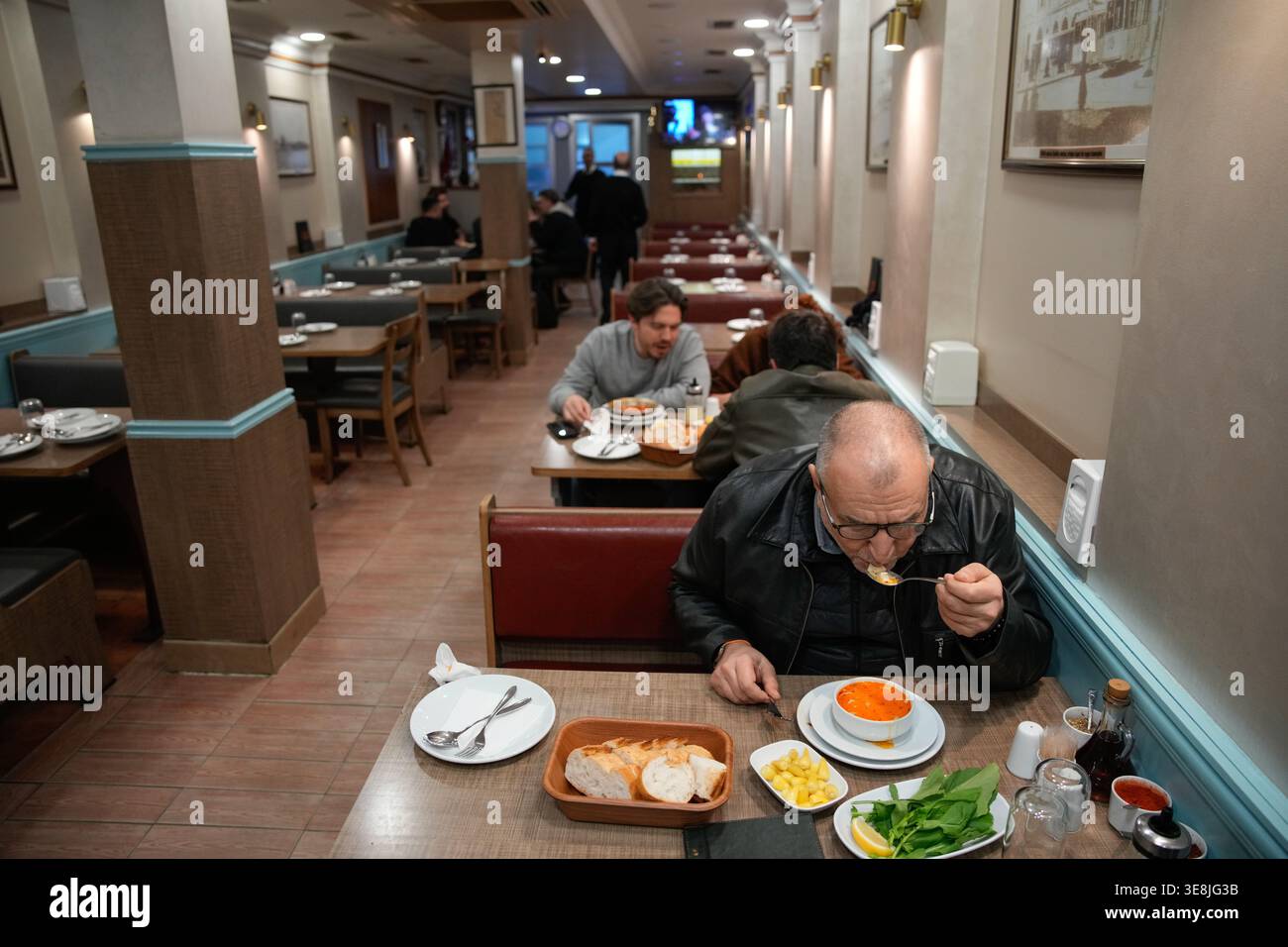 People eat traditional tripe soup, known as "iskembe" in Turkish and ...