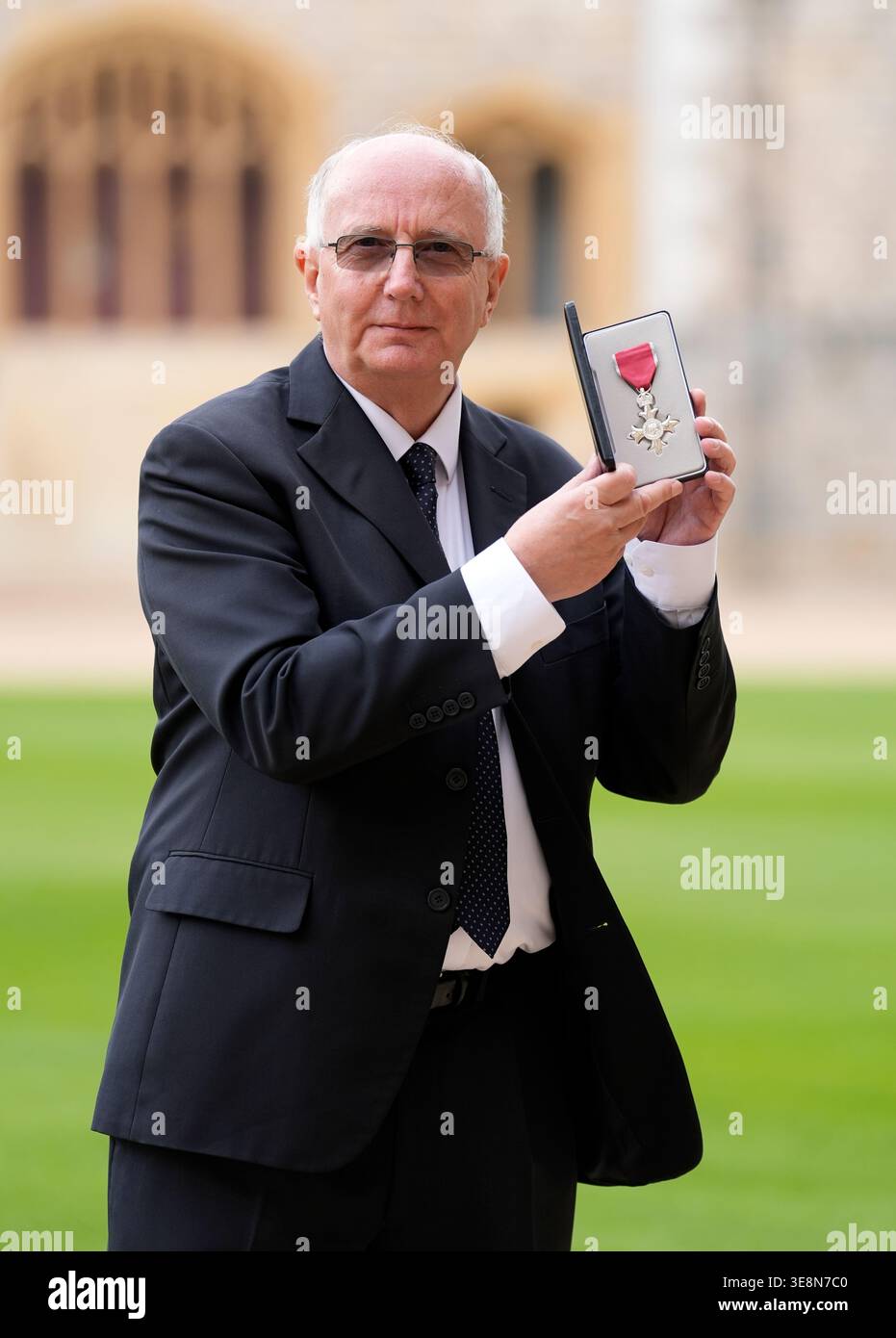 John Pickford, after being made a Member of the Order of the British ...