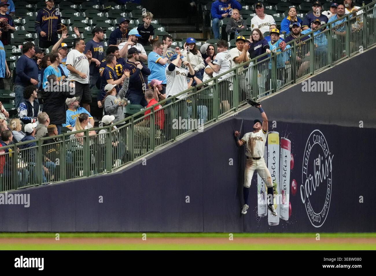 Milwaukee Brewers' Brandon Lockridge makes a leaping catch at the wall ...