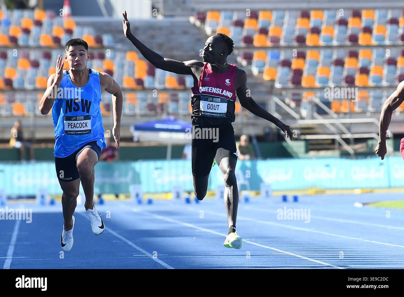 Gout Gout (right) waves while winning the under 20s 100m final during ...