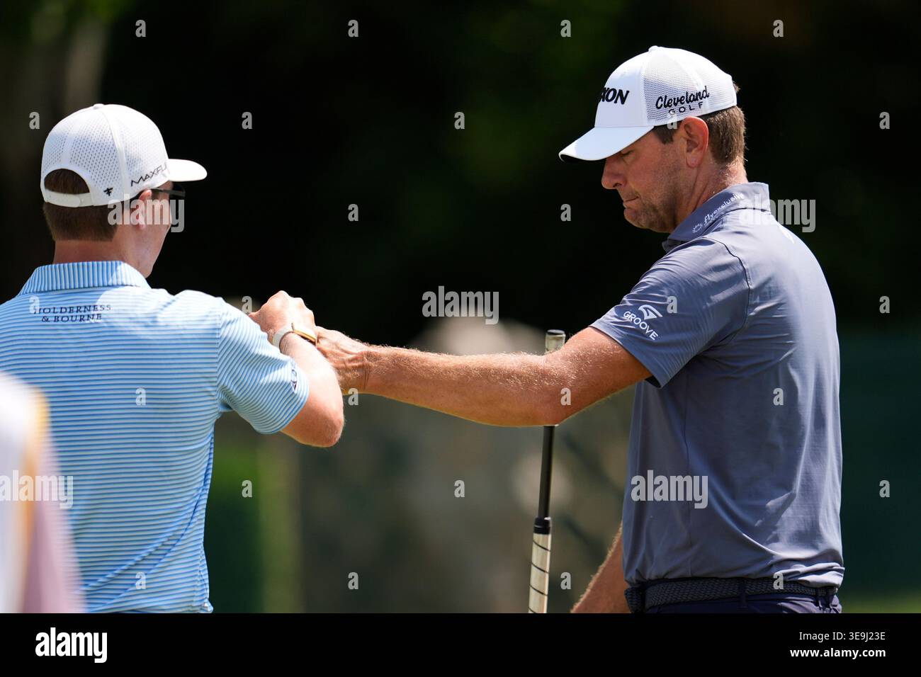 Lucas Glover, right, celebrates his putt on the 16th hole with Ben ...