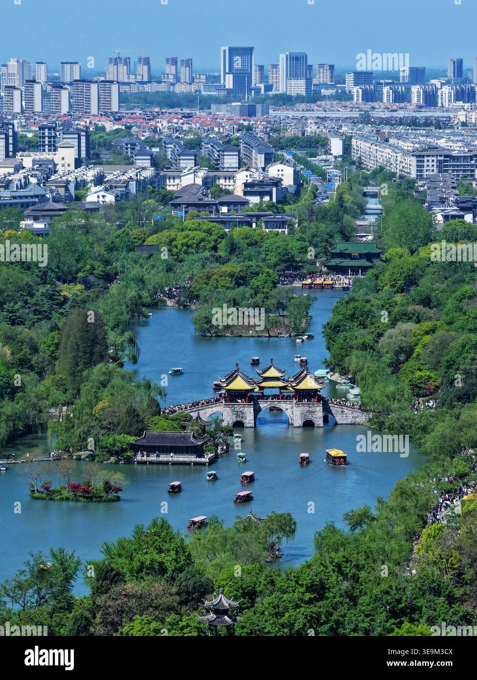 Tourists enjoy the beautiful spring scenery at Slender West Lake in ...
