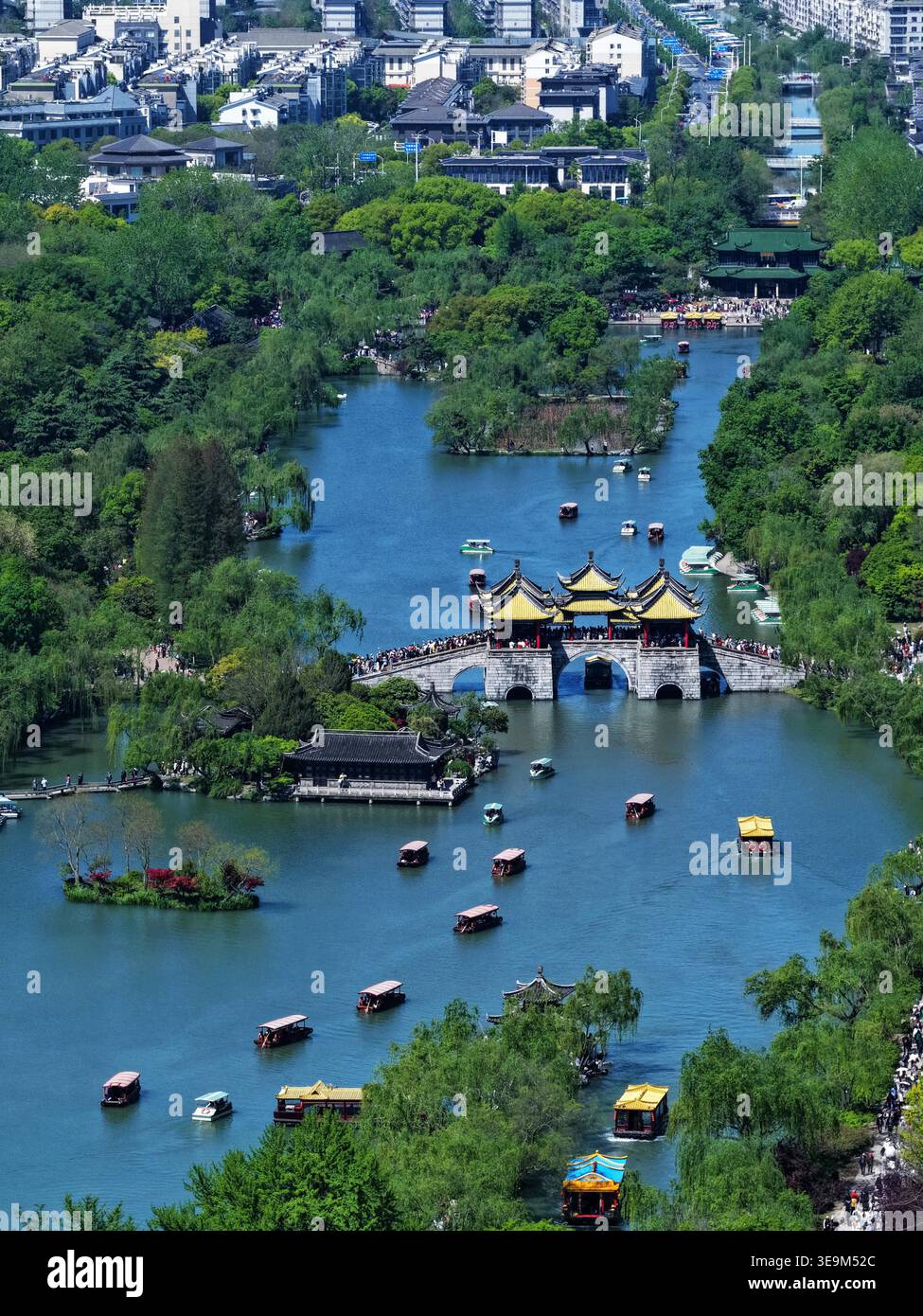 Tourists enjoy the beautiful spring scenery at Slender West Lake in ...
