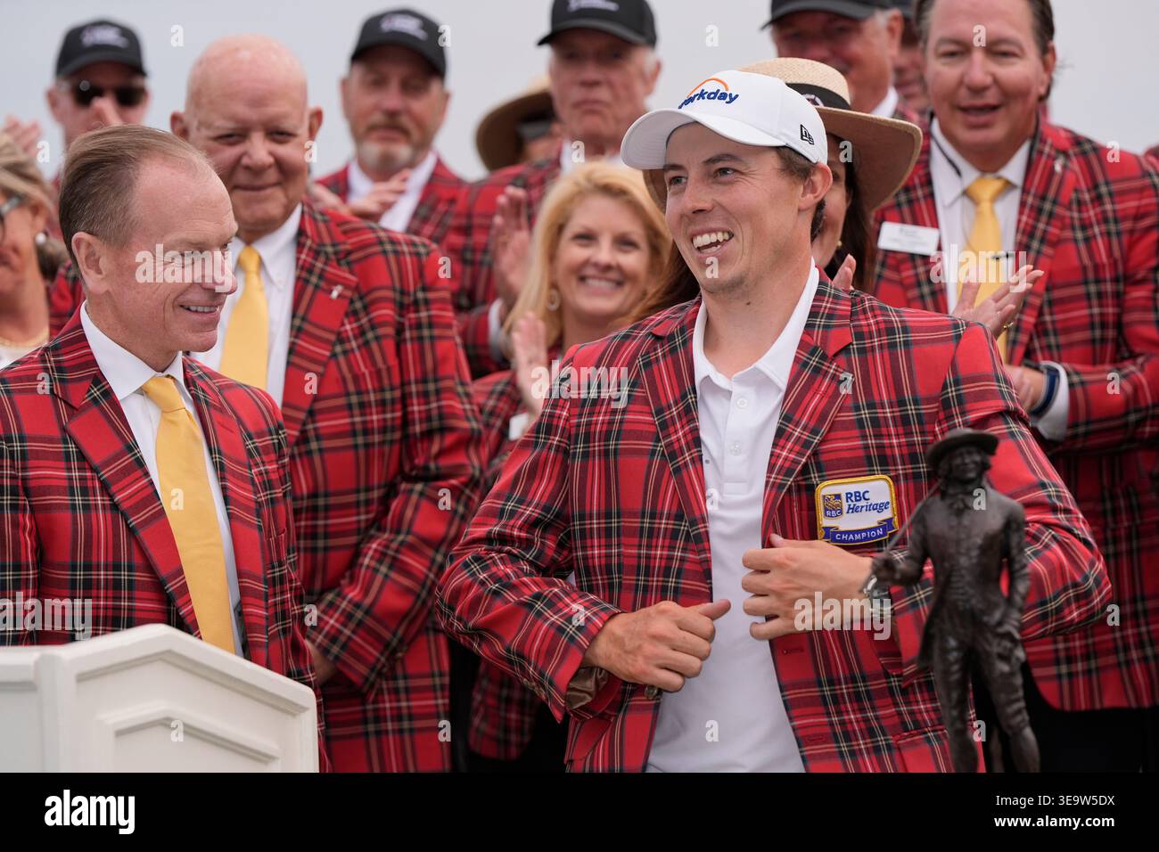 Matt Fitzpatrick, of England, right, puts on the tartan plaid jacket ...