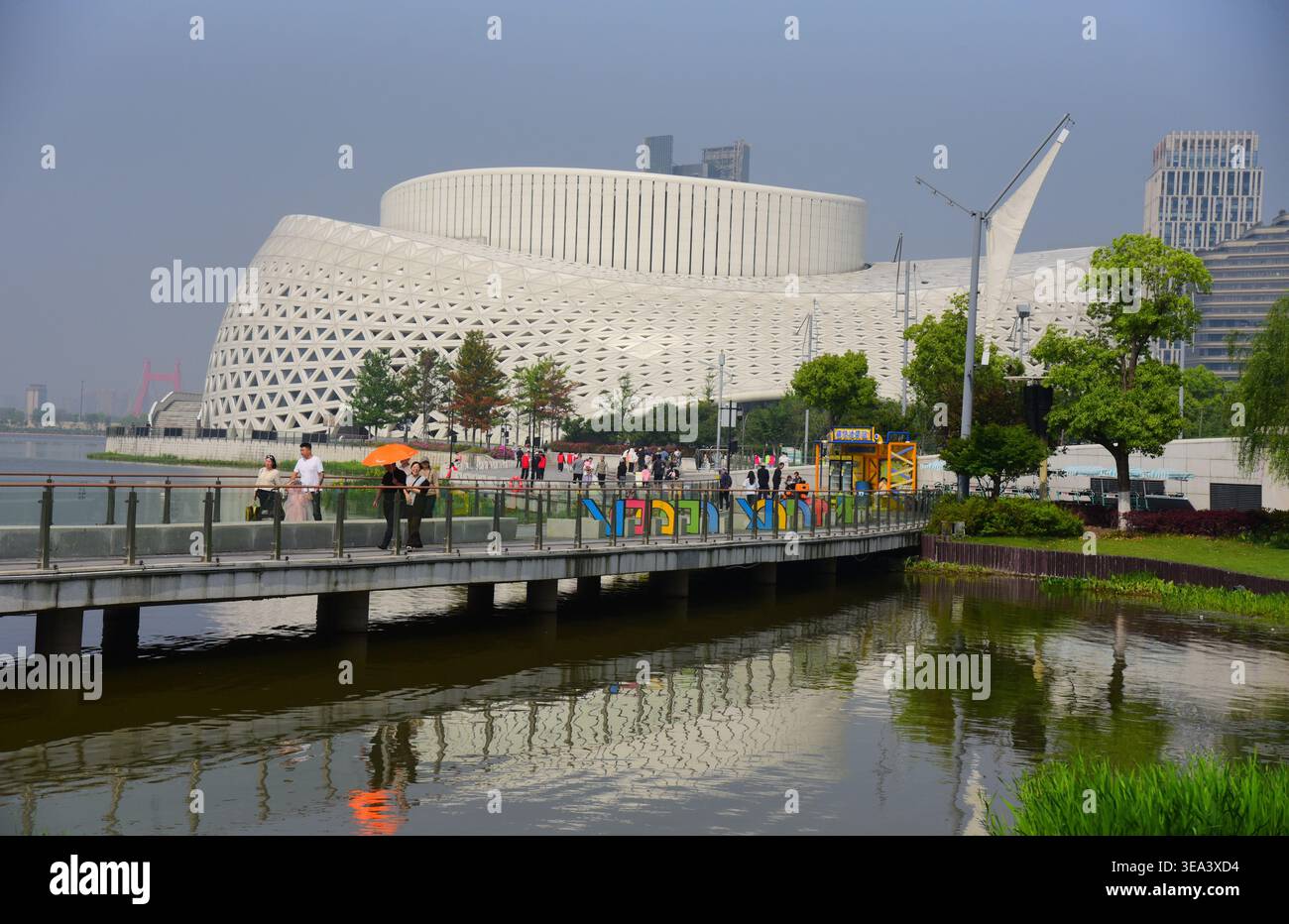 Visitors enjoy the spring scenery at Jinsha Lake Park in Hangzhou, east ...