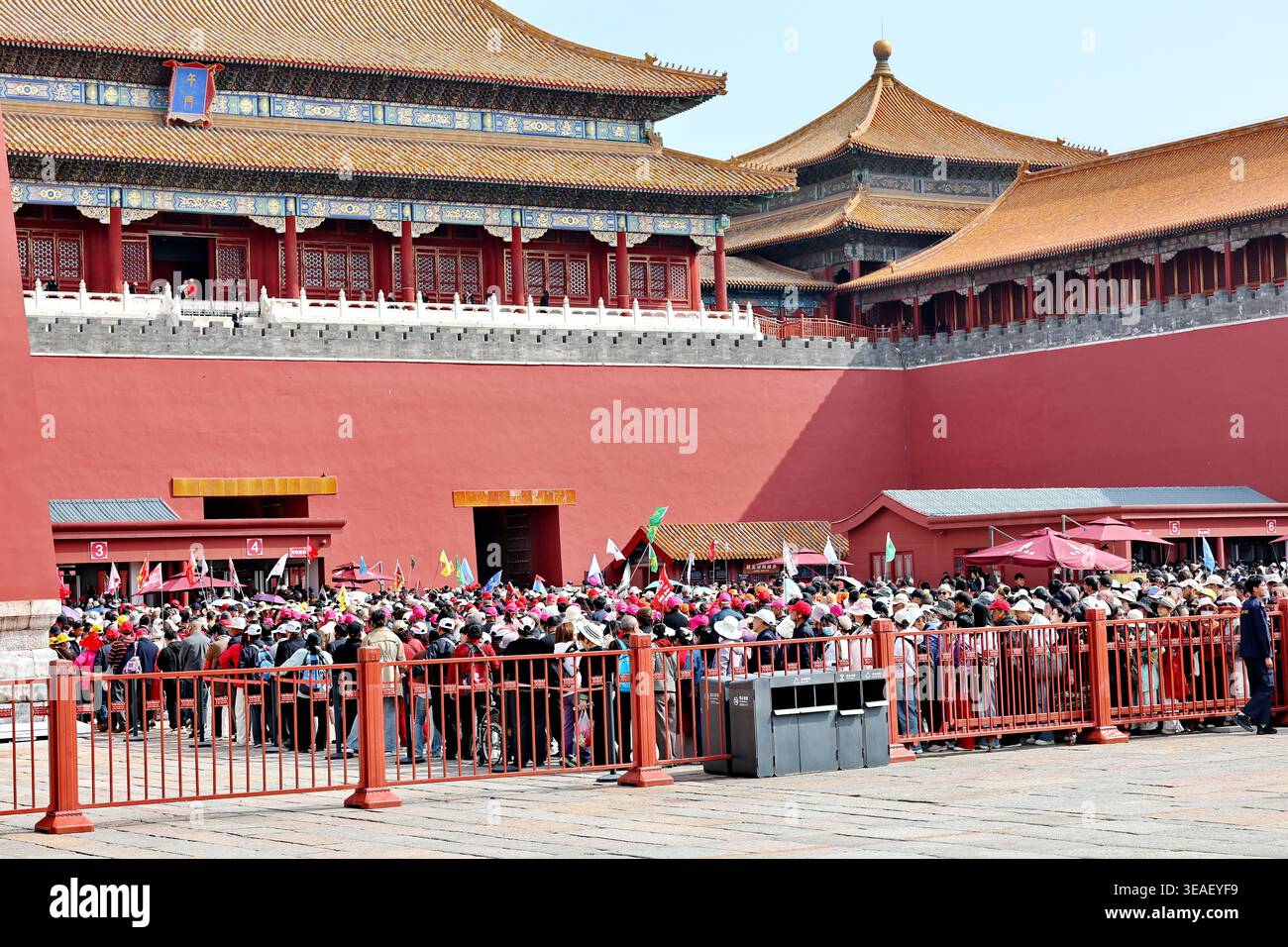 Visitors queue to enter the Palace Museum through the Meridian Gate in ...