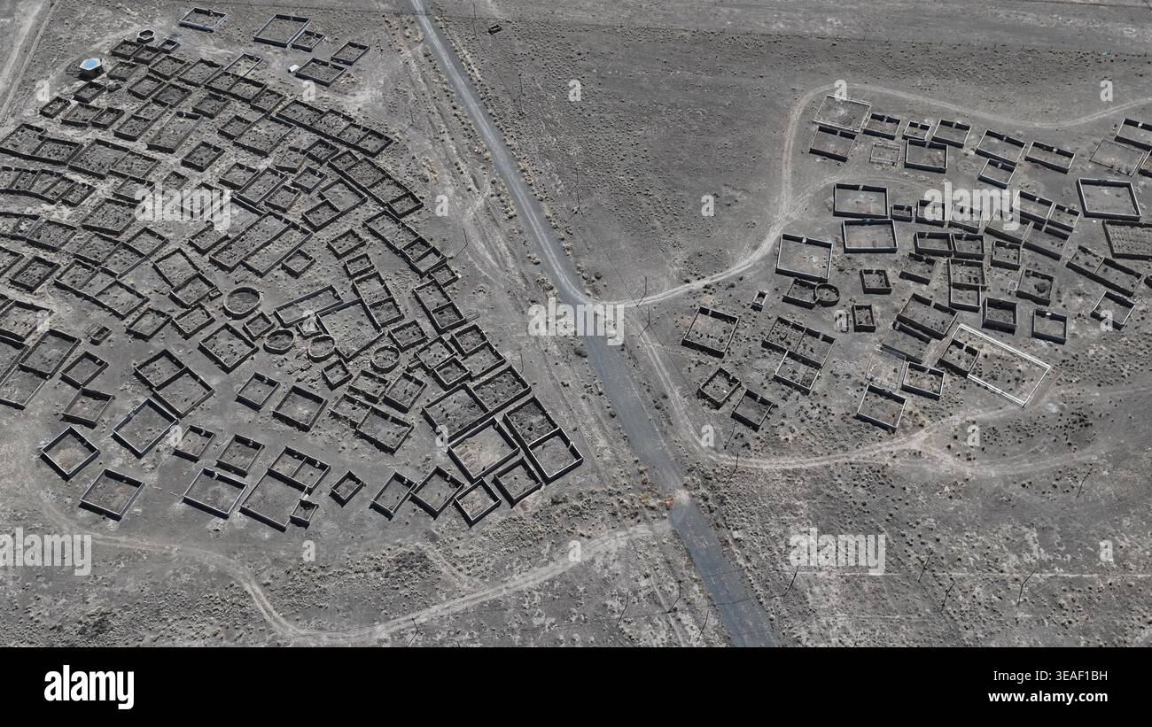 A maze-like sheepfold built with layered stones stands in the ...
