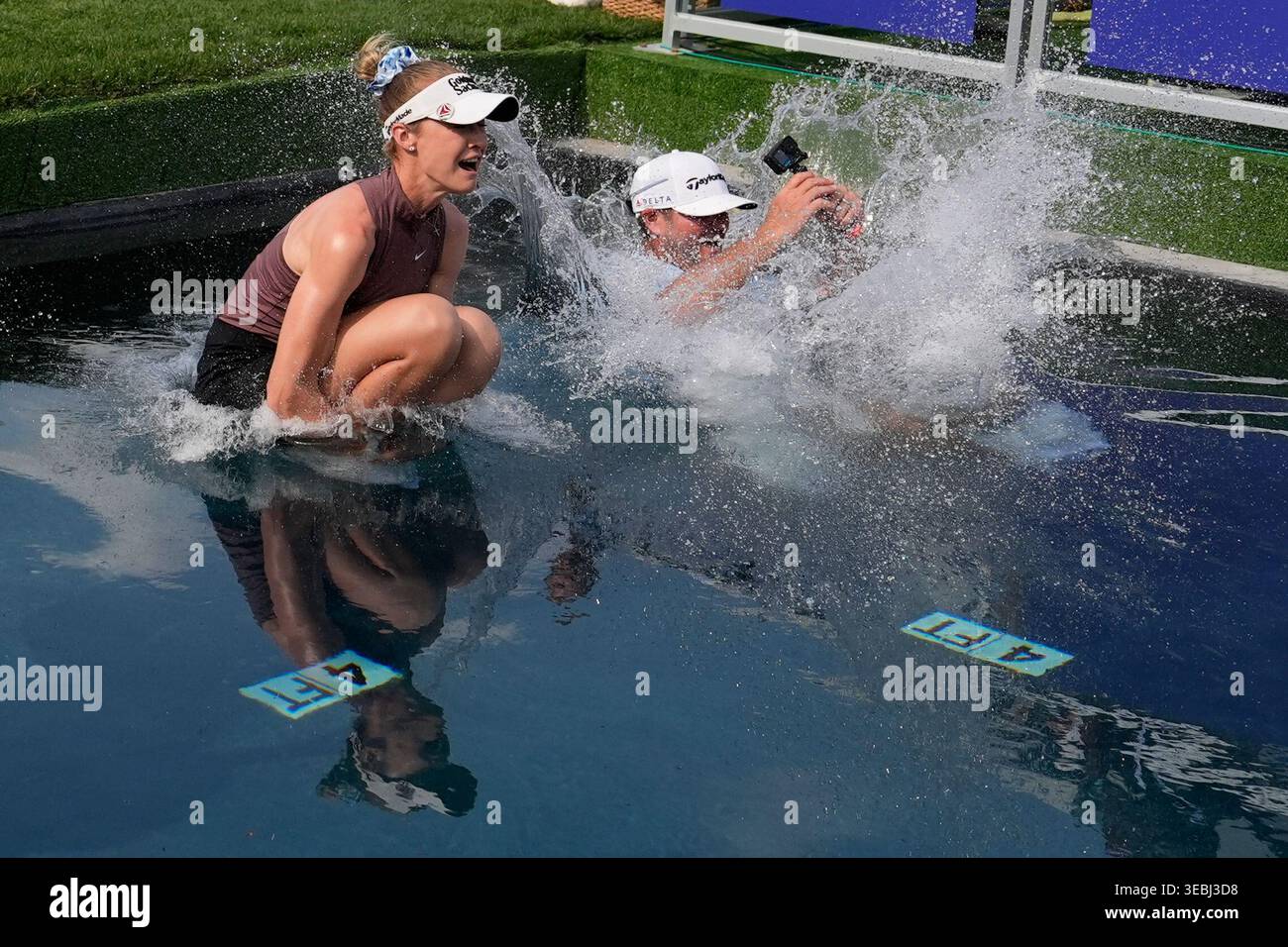 Nelly Korda jumps in the water with her caddie after winning the ...