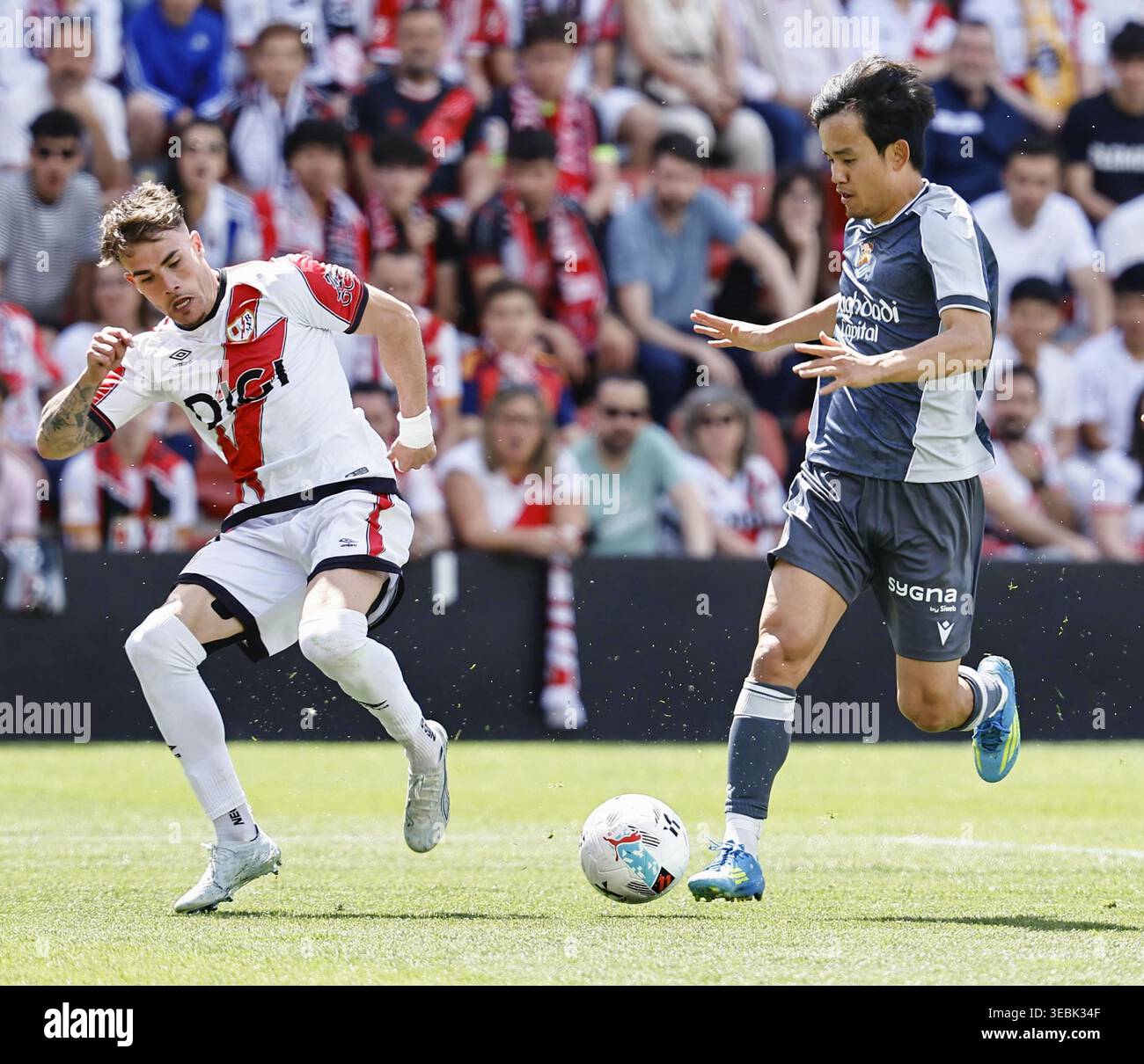 Takefusa Kubo (R) of Real Sociedad dribbles the ball in a Spanish La ...