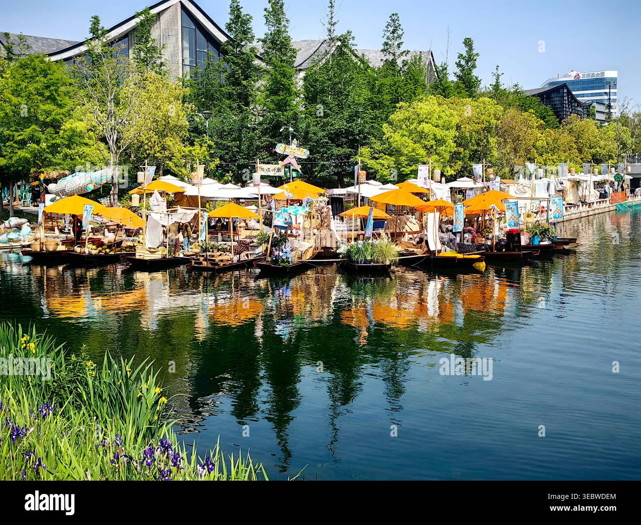 Visitors explore the waterfront market at Panlong Tiandi during the 3rd ...