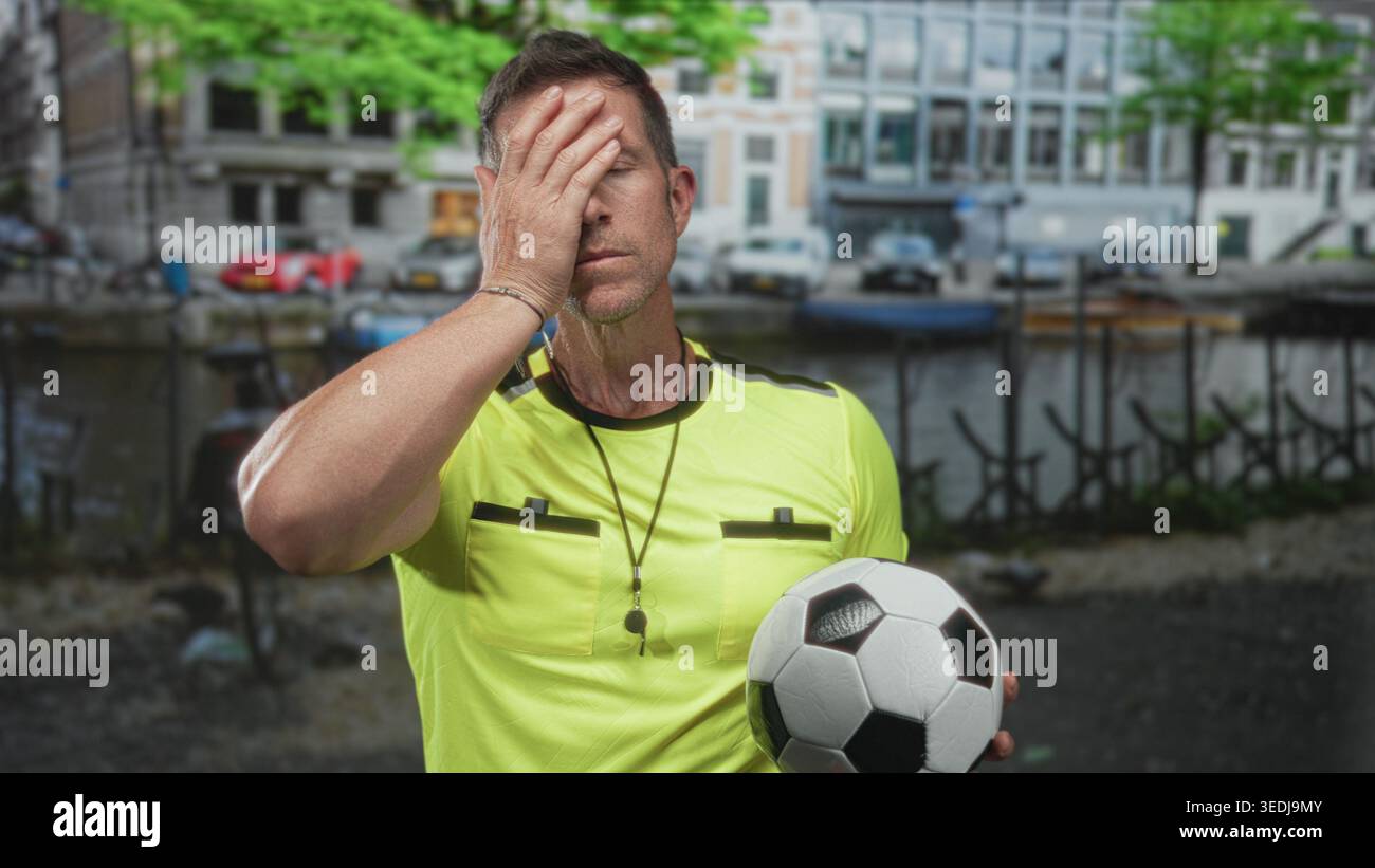 Soccer player covering his face with his shirt hi-res stock photography ...