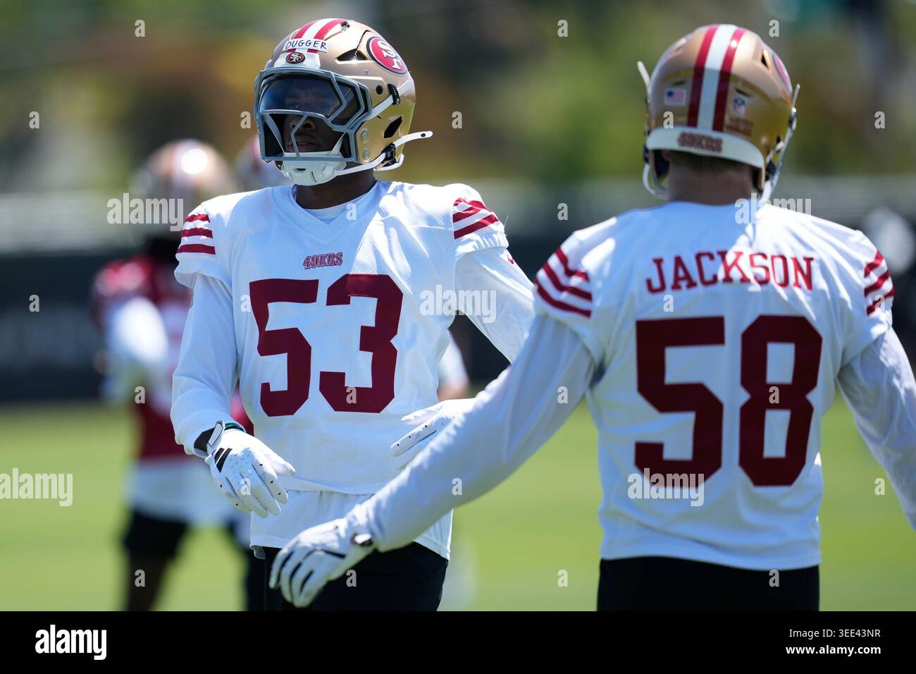 San Francisco 49ers' Jaden Dugger (53) and James Jackson (58) walk on ...