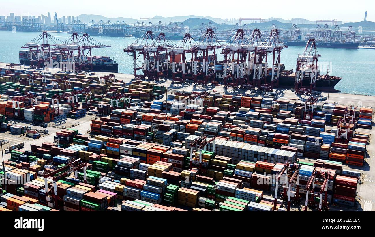 A cargo ship loads and unloads foreign trade containers at Qingdao Port ...