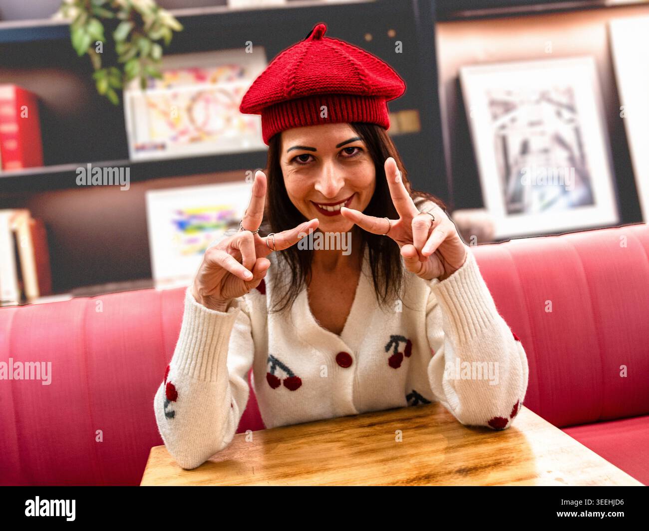 Smiling woman in sweater showing hi-res stock photography and images ...