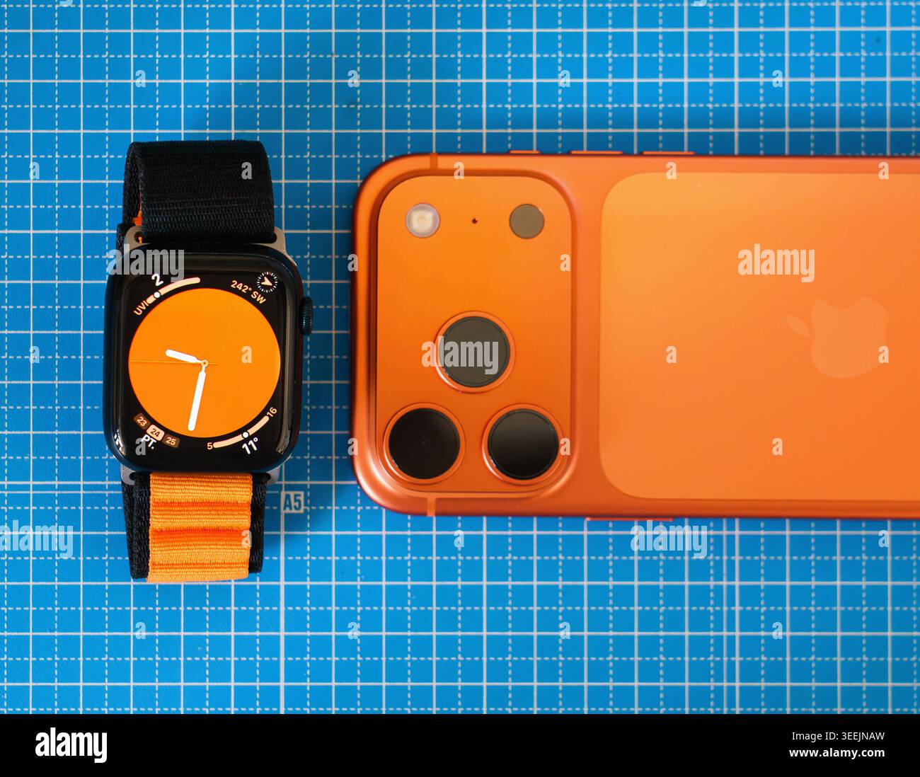 WARSAW, POLAND - MAY 11, 2026: An orange iPhone and Apple Watch Ultra ...
