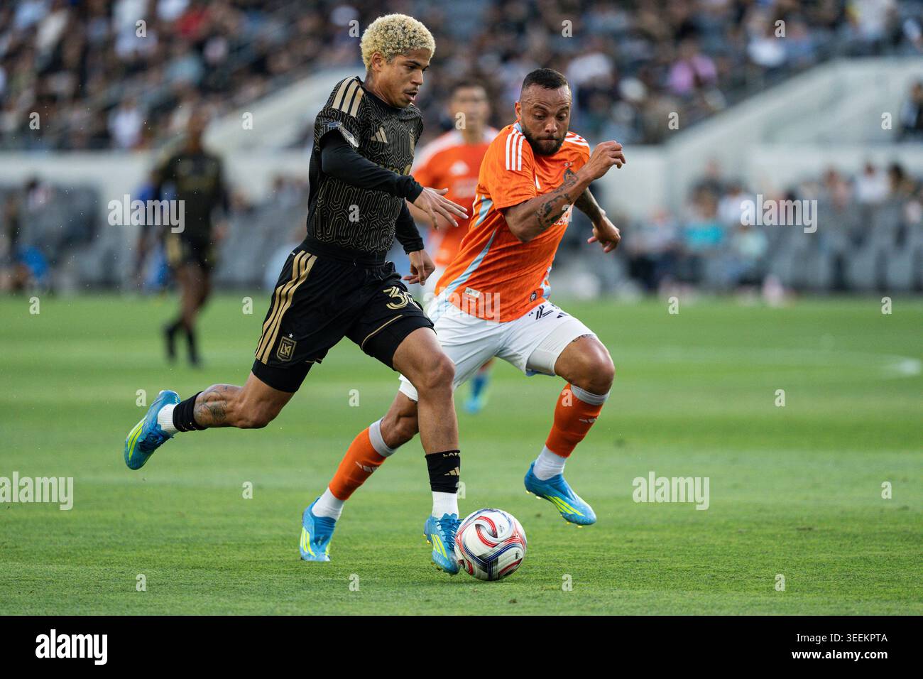 LAFC forward David Martínez (30) is defended by Houston Dynamo forward ...