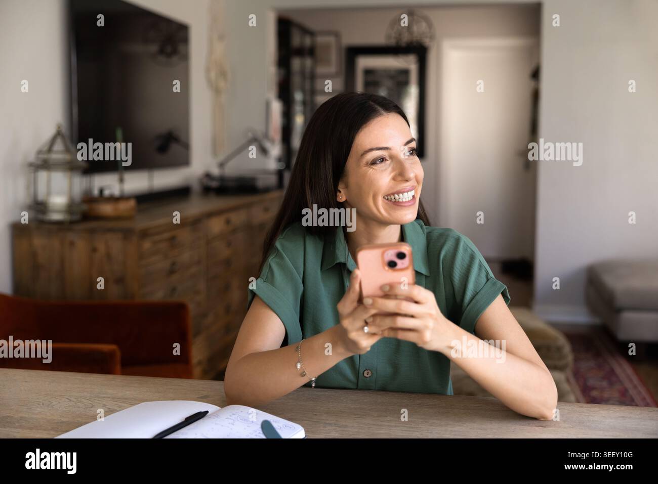 Woman sits table in relaxed hi-res stock photography and images - Alamy