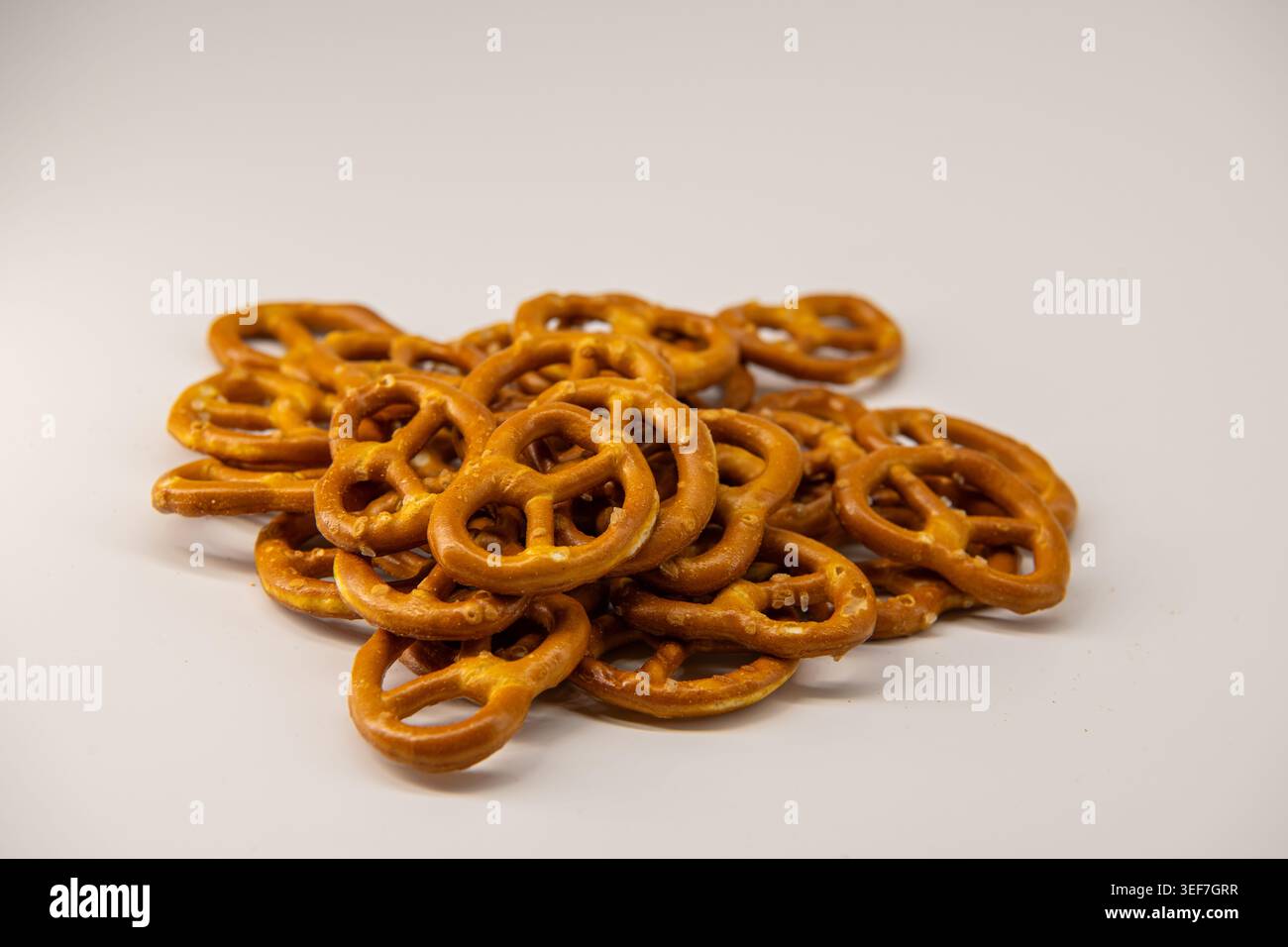 Delicious pretzels isolated on white background Stock Photo - Alamy