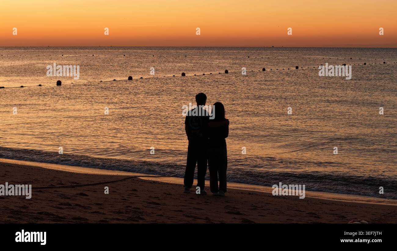 Romantic Couple Silhouette Standing on Beach at Sunset Stock Photo - Alamy