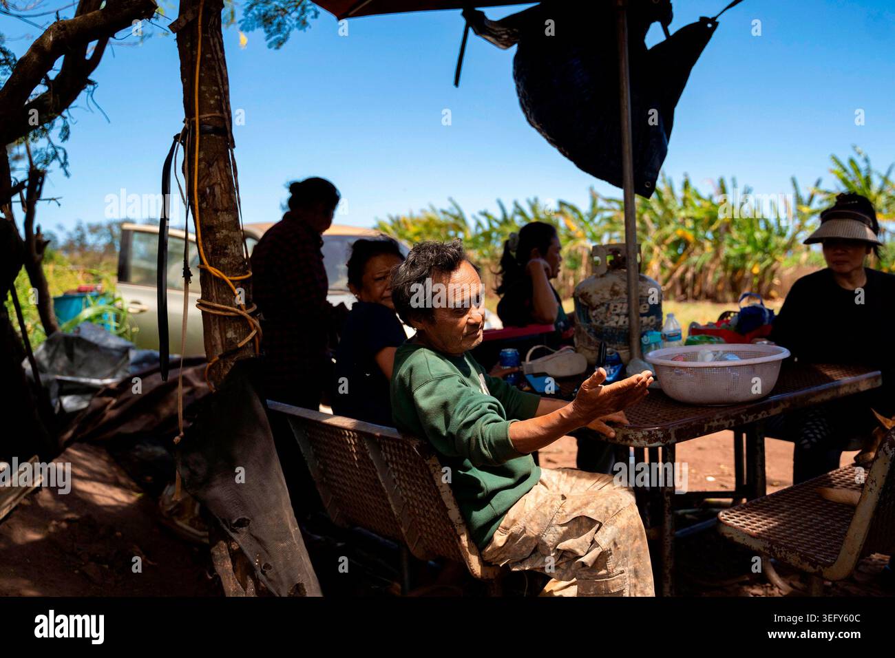 Bok Kongphan chats with family members at his farm, Monday, May 4, 2026 ...