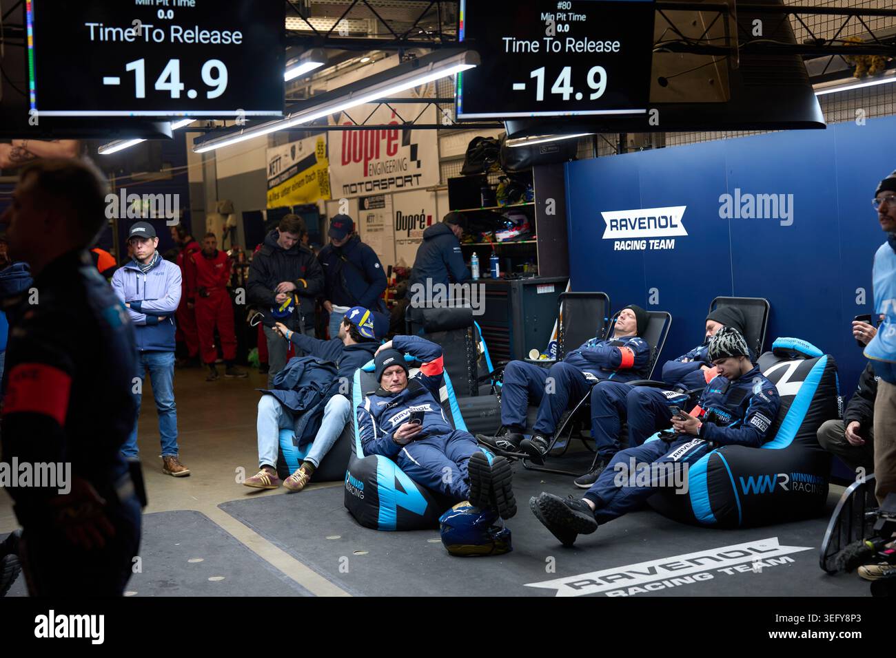 A pit crew rests during the Nurburgring 24-hour auto race in Nurburg ...