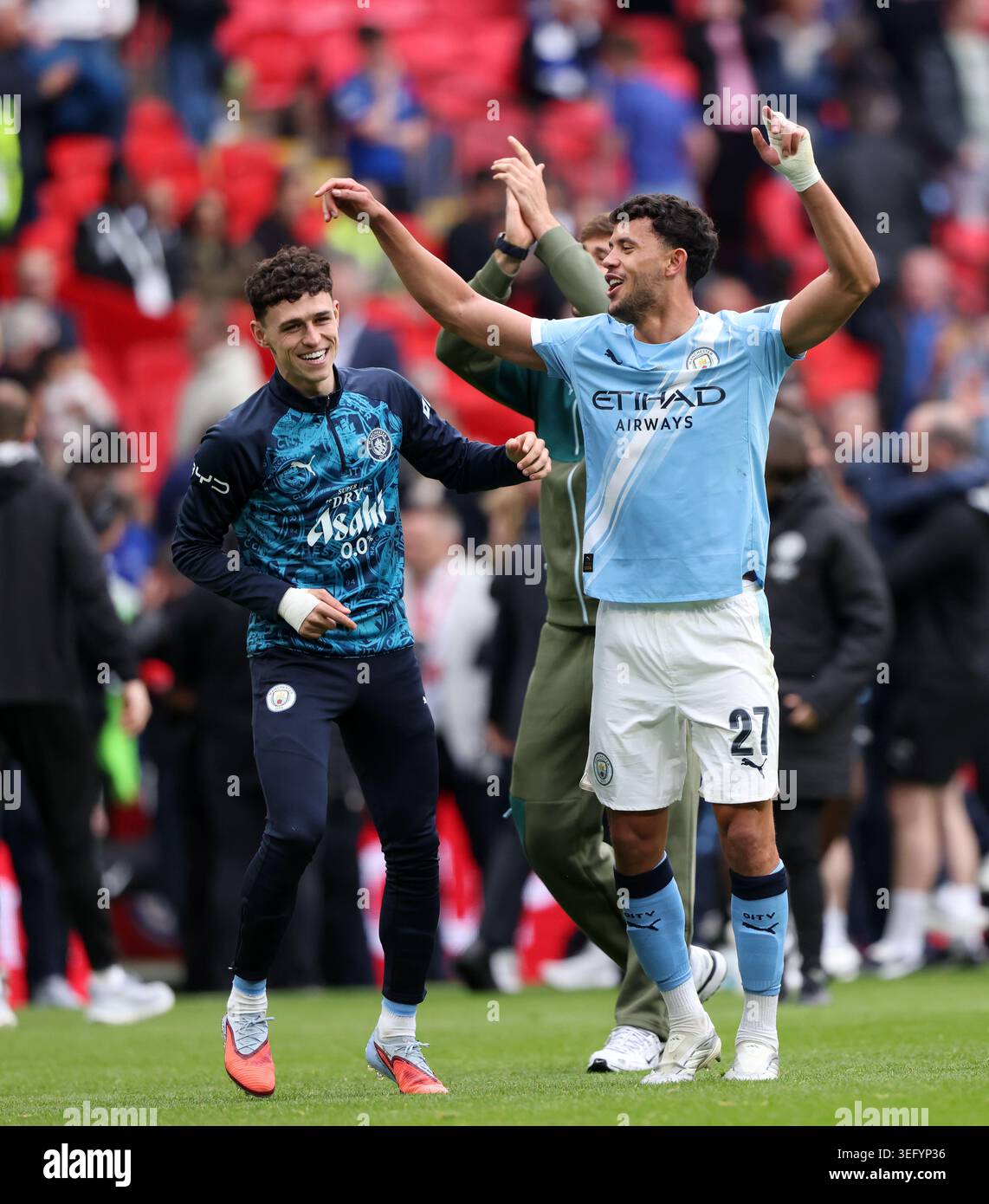 Phil Foden (MC) and Matheus Nunes (MC) celebrate victory at the ...
