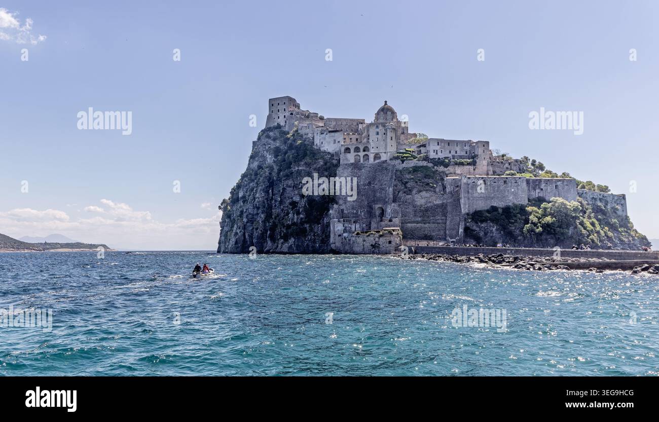 Small boat approaching Castle Aragonese in Ischia, Italy on 2 May 2026 ...