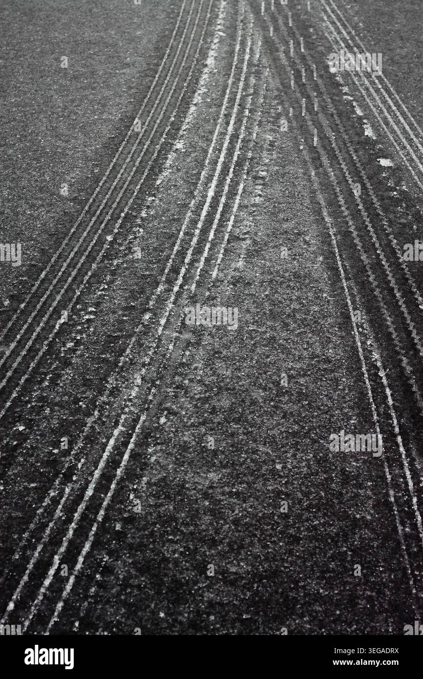 Winter Scene with Snow Icy Tracks on Ground Stock Photo - Alamy