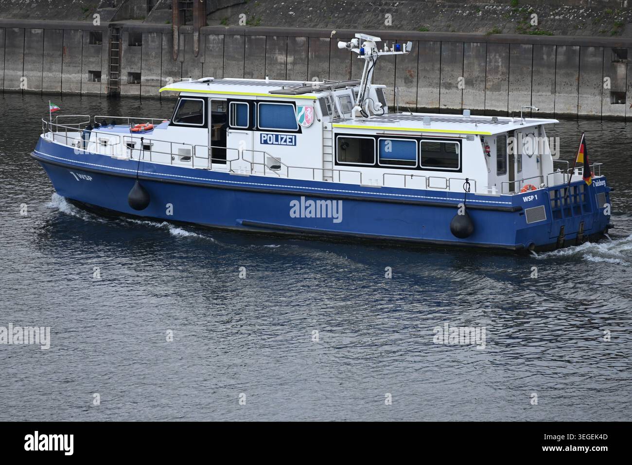 The patrol boat police boat WSP 1 is sailing through the Duisburg port ...