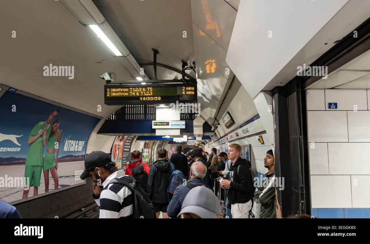 London, United Kingdom, 14 July 2023, commuters stand on Green Park ...