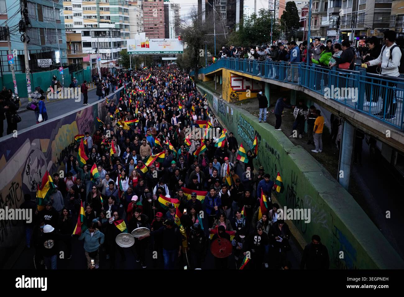 People march against protesters blocking the access to the city, in La ...
