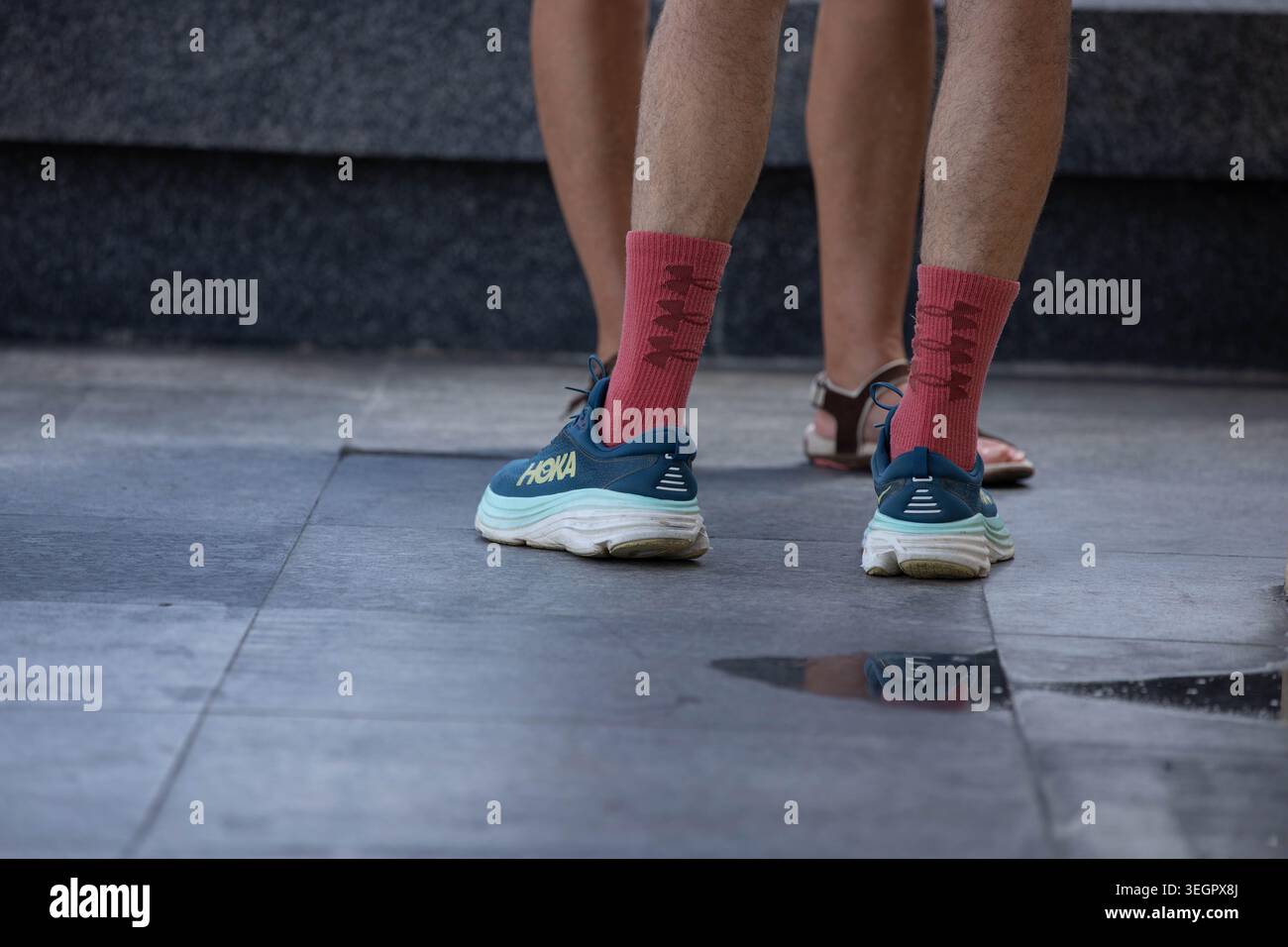 BANGKOK, THAILAND-MAY 13, 2026: Male in blue sneakers walking travel ...