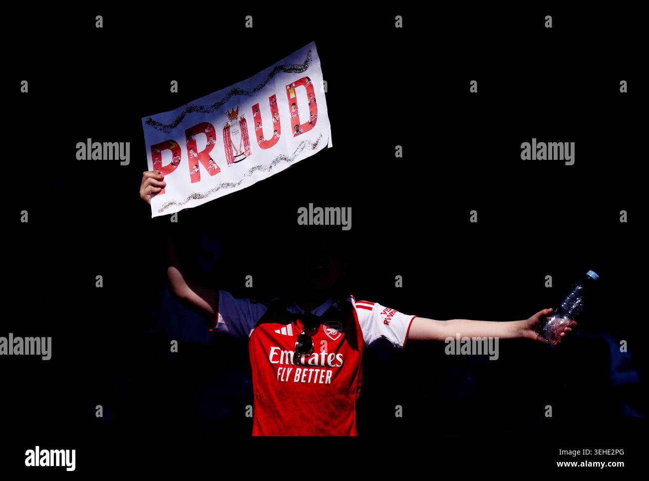 An Arsenal fan holding a banner that reads 'Proud' ahead of the Premier ...