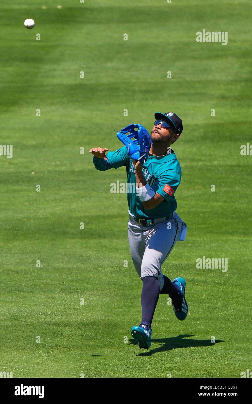Seattle Mariners center fielder Julio Rodriguez catches a fly ball for ...