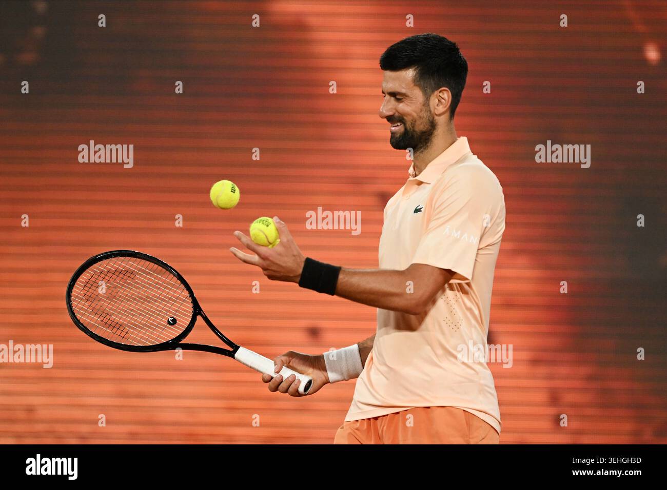 Novak Djokovic of Serbia prepares to serve against Giovanni Mpetshi ...