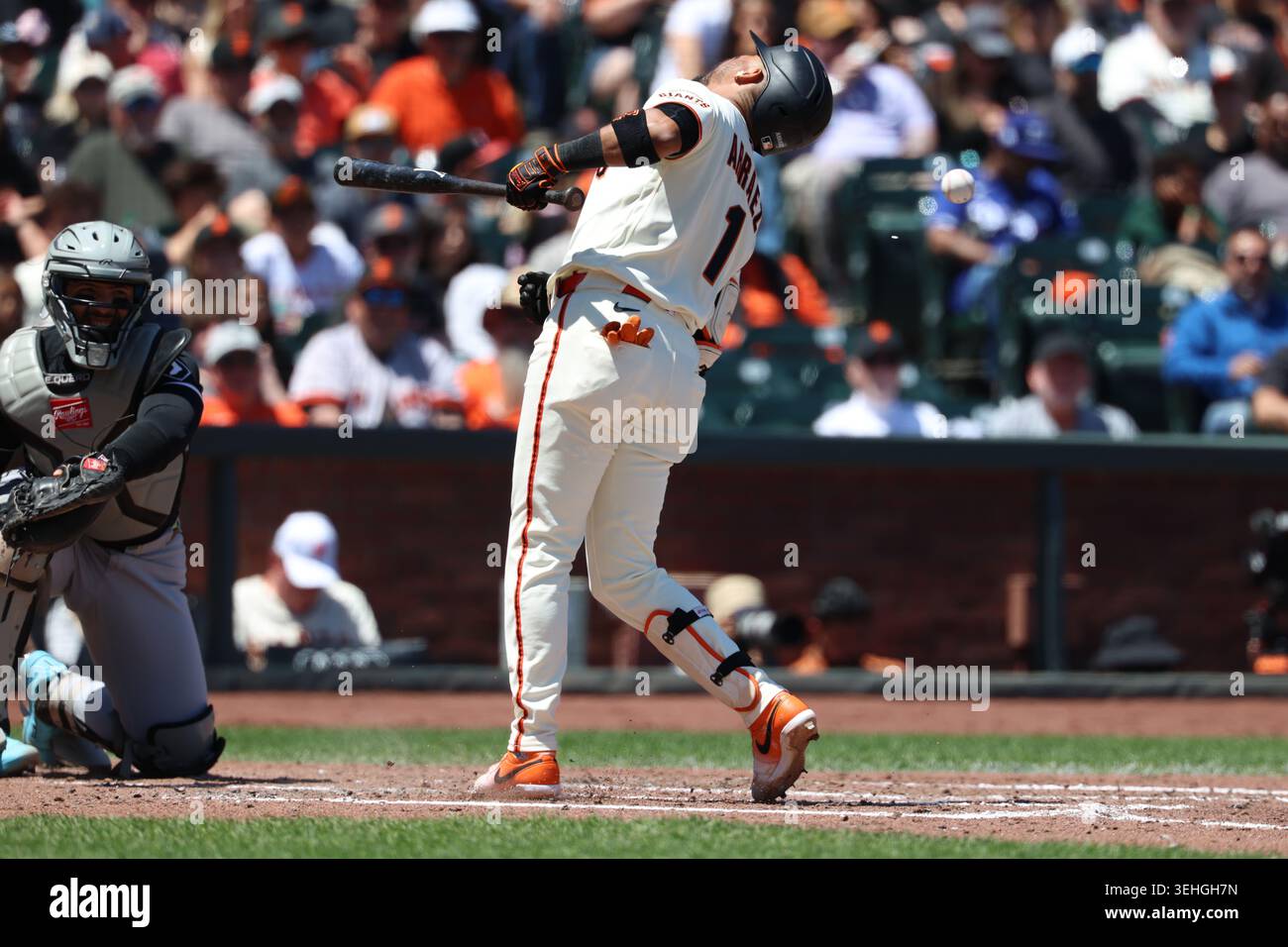 San Francisco Giants' Luis Arraez (1) is hit by a pitch in front of ...