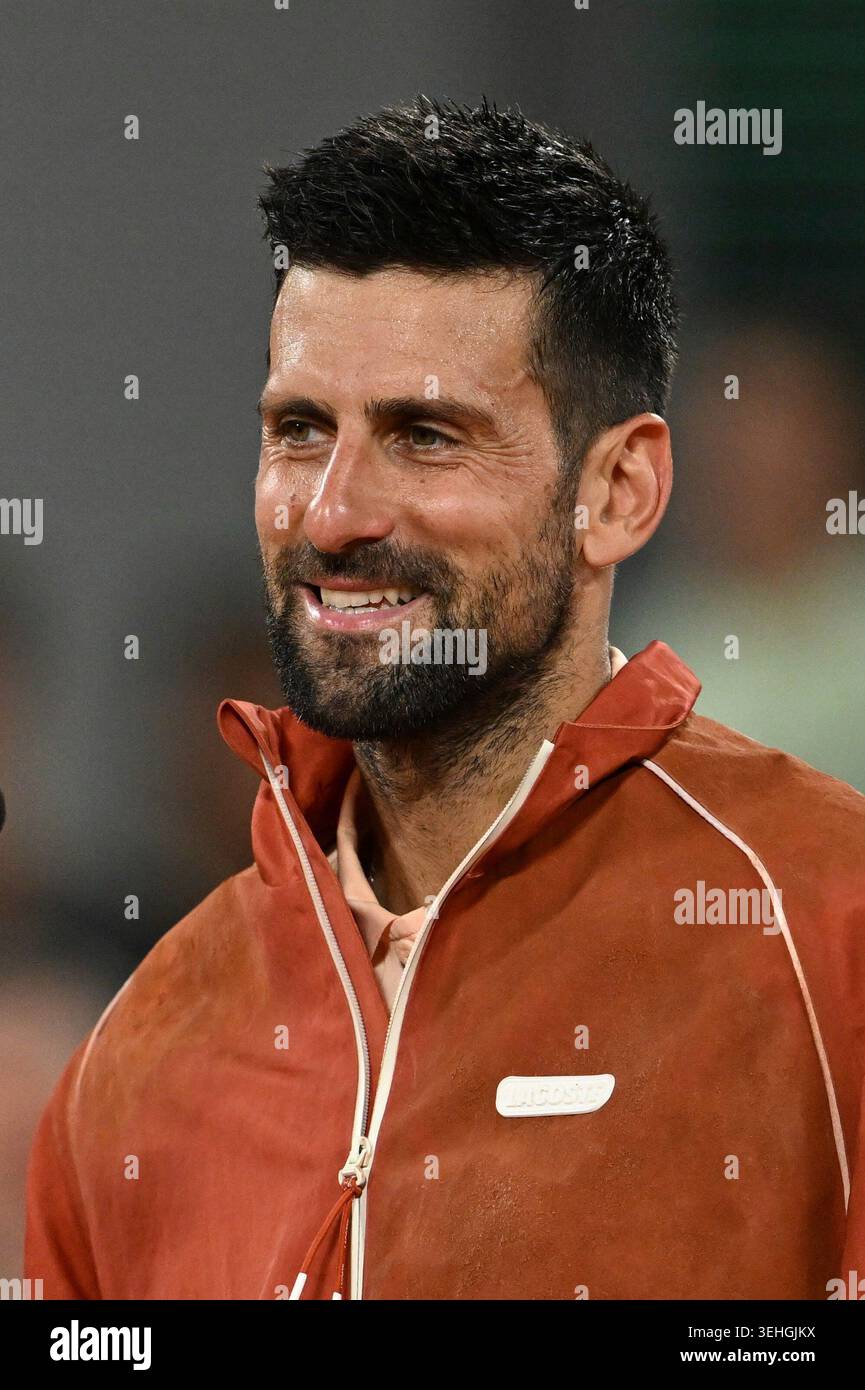 Novak Djokovic of Serbia smiles after winning the first round men's ...