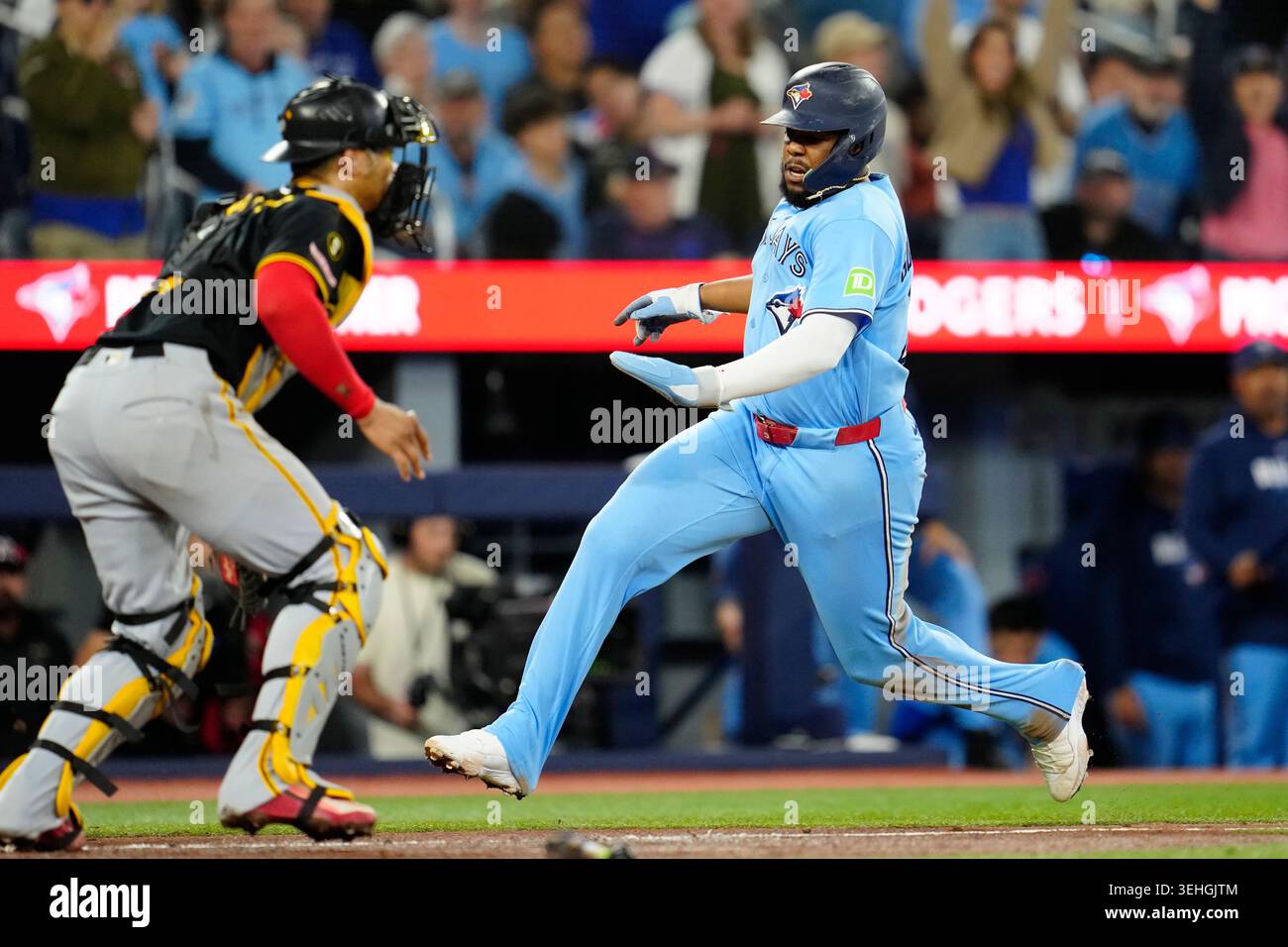 Toronto Blue Jays first baseman Vladimir Guerrero Jr. (27) scores on a ...