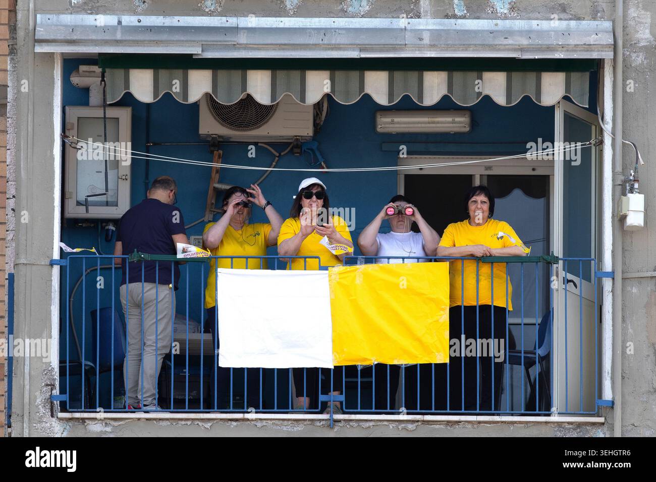 People wait for Pope Leo XIV's arrival in Calipari Square during his ...
