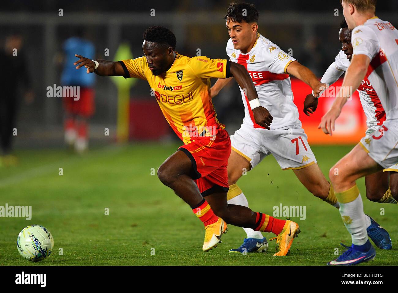 Lecce's Konan N'Dri (11) and Genoa's Filippo Carbone (71) in action ...