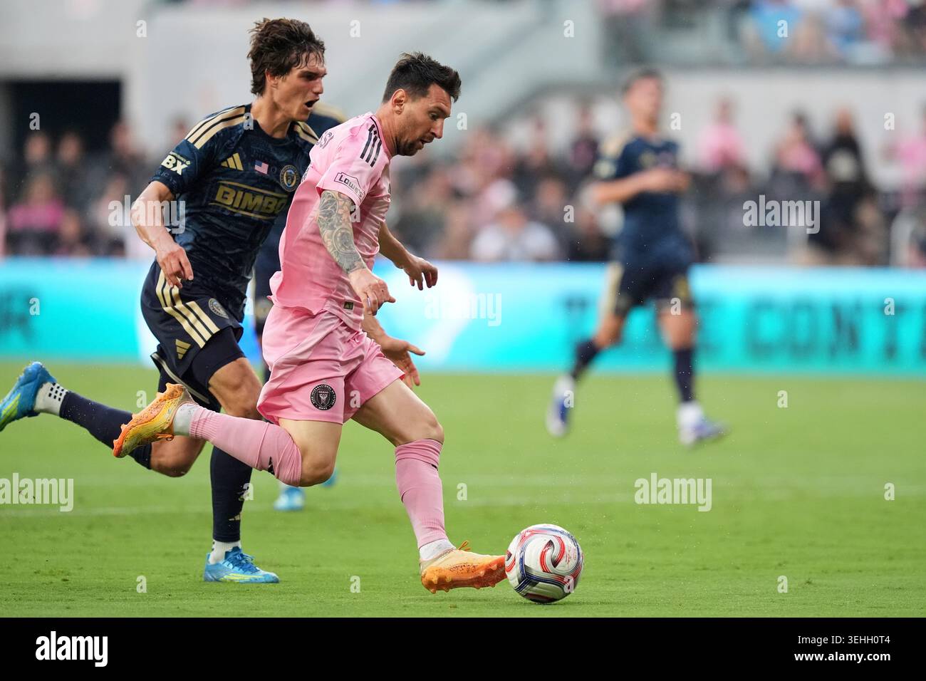 Inter Miami forward Lionel Messi (10) drives downfield under pressure ...