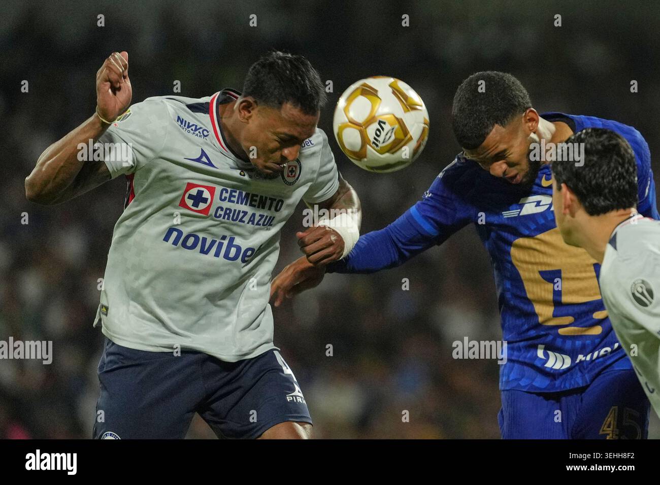 Cruz Azul's Willer Ditta, left, and Pumas' Pedro Vite vie for the ball ...