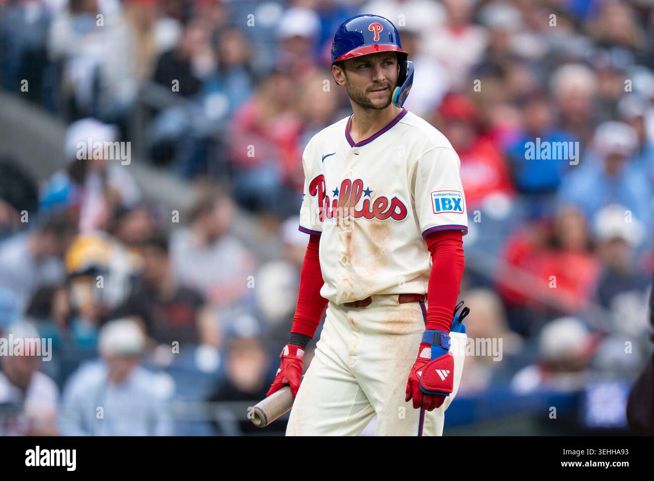 Philadelphia Phillies' Trea Turner looks back after striking out during ...