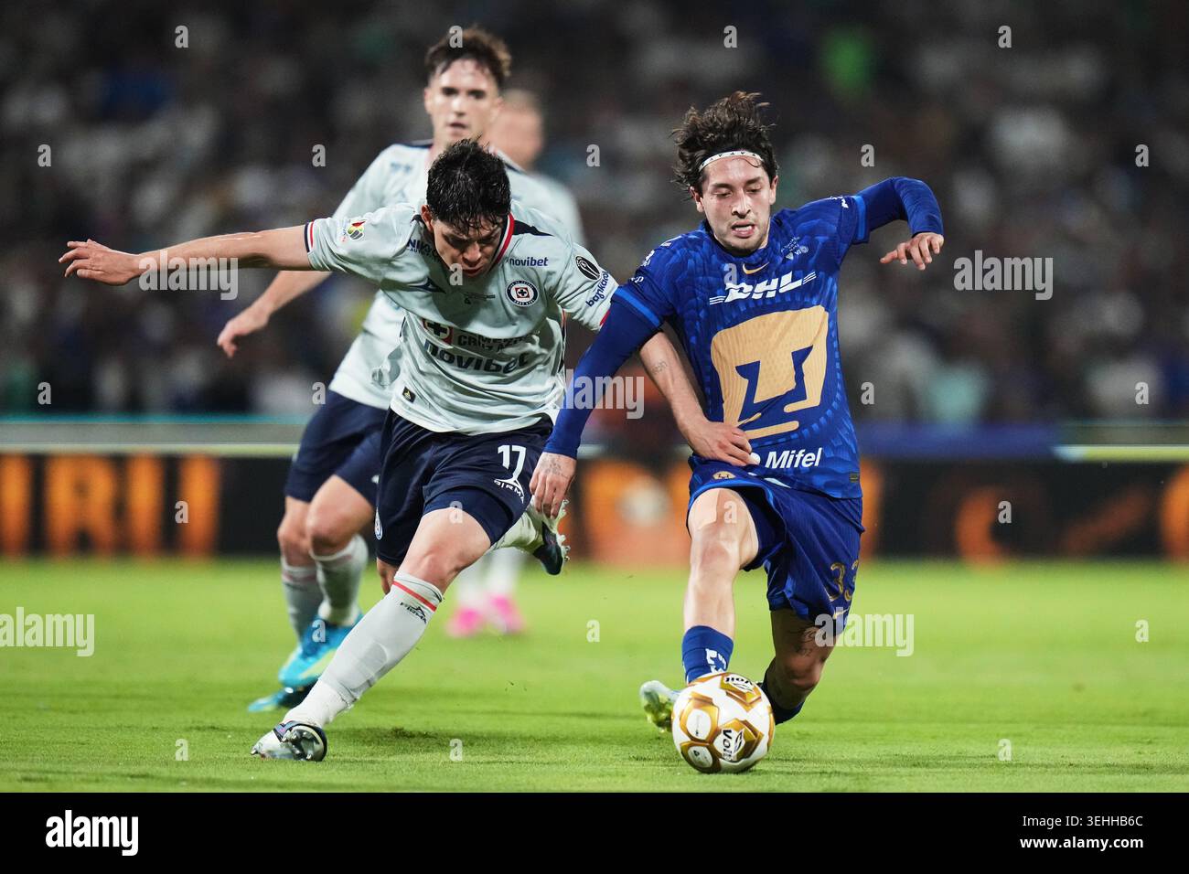 Pumas' Jordan Carillo, right, and Cruz Azul's Amaury Garcia vie for the ...