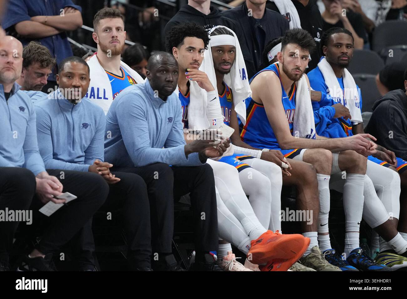 Oklahoma City Thunder players sit on the bench during the final minutes ...